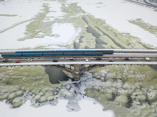 Two metro trains on Kiev bridge across the frozen Dnieper river ...