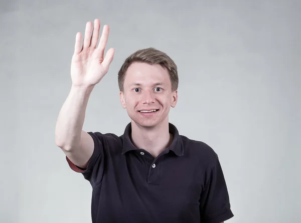 Young guy say hello Stock Photo by ©filistimlyanin 111545392