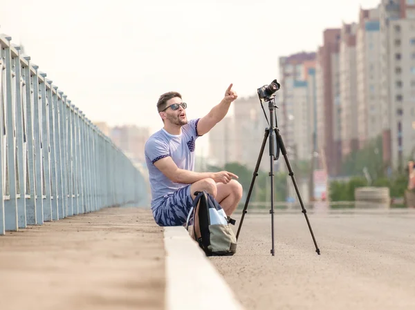 Man with camera on tripod - Stock Image - Everypixel