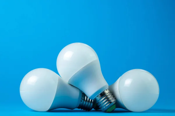 LED light bulbs on a blue background. Modern light source - Stock Image ...