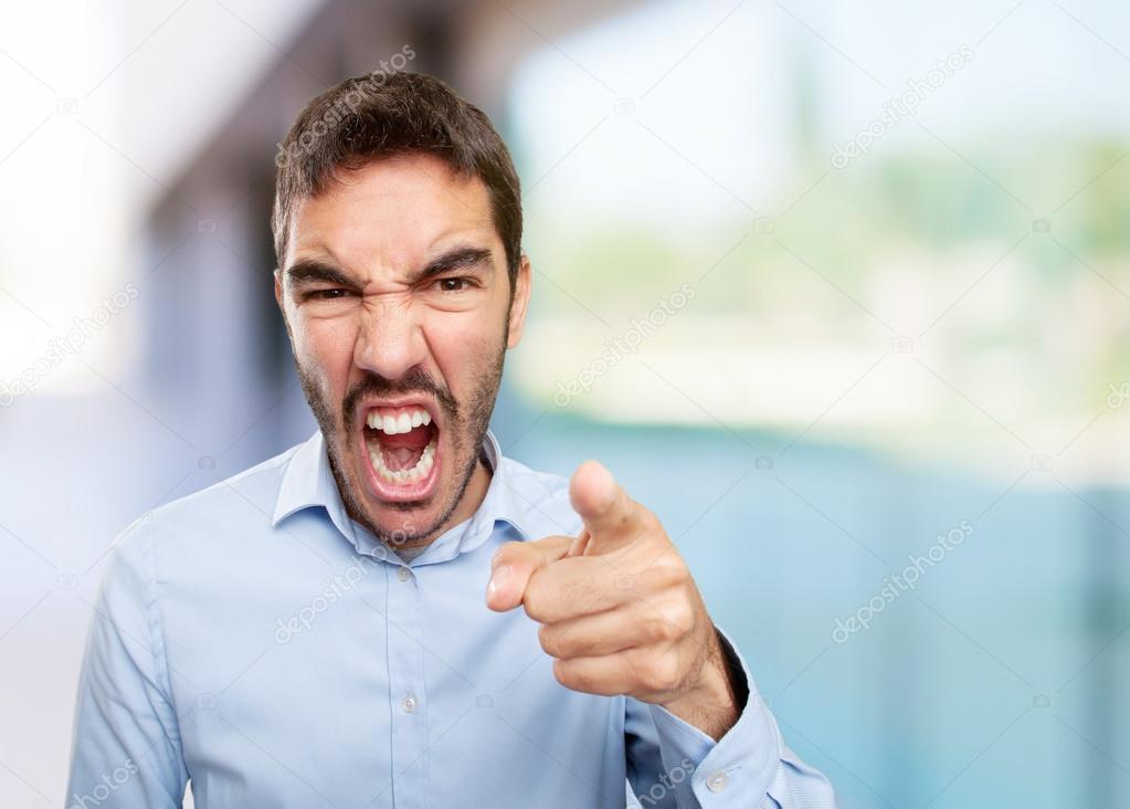 Close up of an angry man pointing — Stock Photo © agongallud #84405026