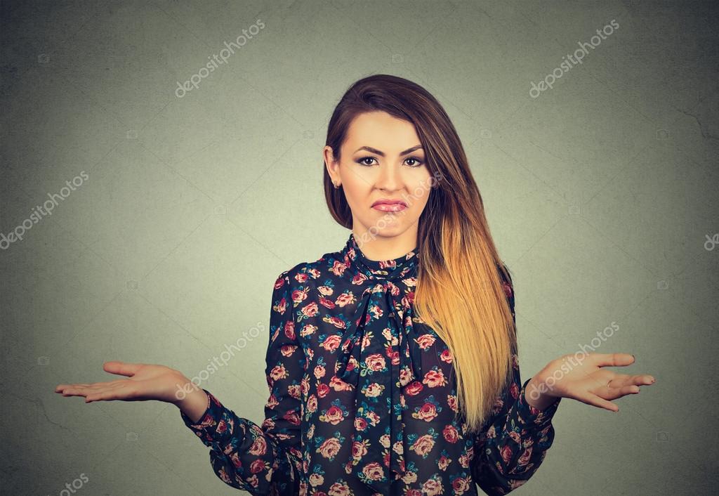 Young woman shrugging shoulders Stock Photo by ©SIphotography 102369542
