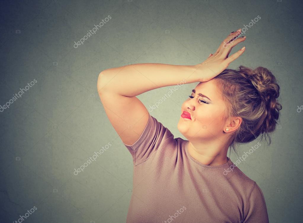 Regrets wrong doing. Silly woman, slapping hand on head having duh ...