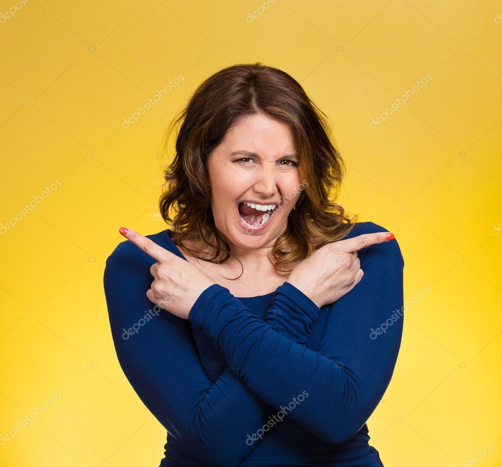 Woman pointing in two different directions, stressed, frustrated Stock ...