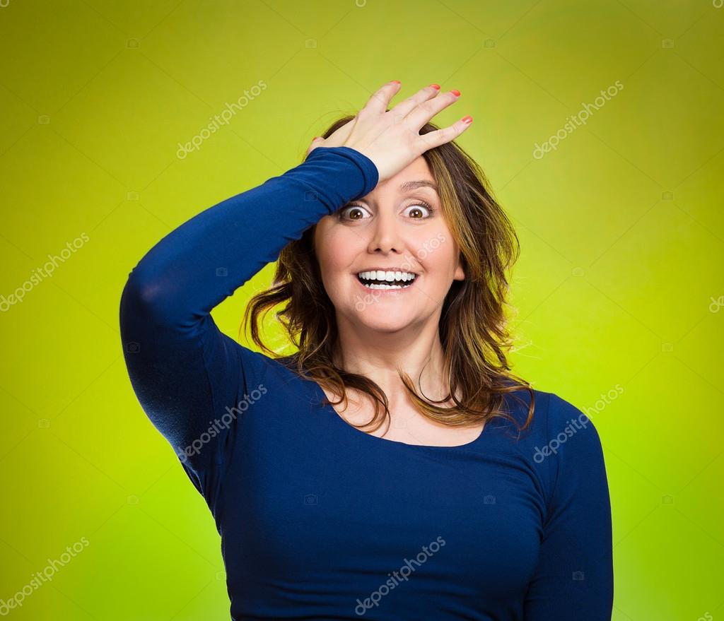 Woman placing hand on head, palm on face gesture in duh moment Stock ...