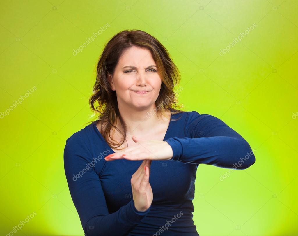 Serious woman showing time out gesture with hands Stock Photo by ...