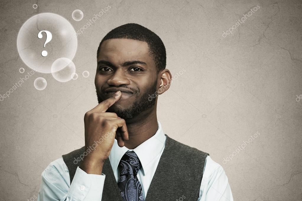 Puzzled business man thinking Stock Photo by ©SIphotography 52802521