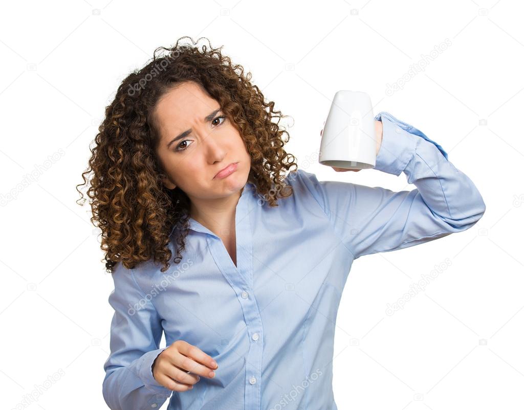 Grumpy, unhappy, annoyed funny looking, tired, woman with empty cup of ...