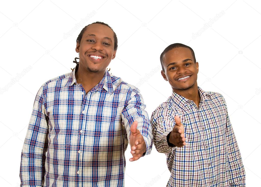 Two young men giving hand shake Stock Photo by ©SIphotography 53691695