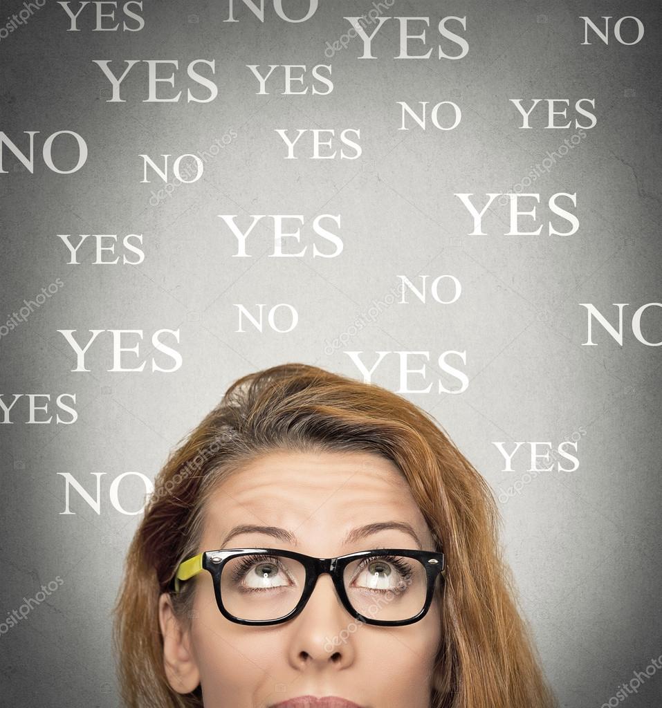 Uncertain woman looking up, background with yes no choices — Stock ...