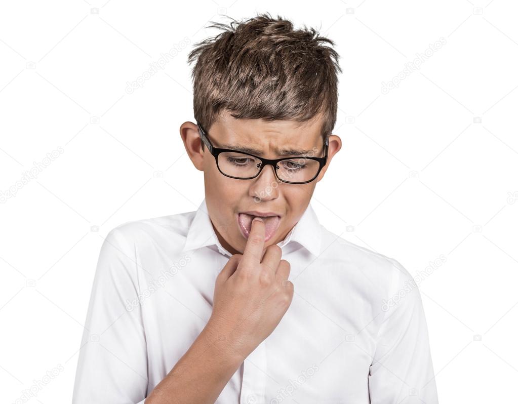 Annoyed boy with finger in mouth, disgusted Stock Photo by ...