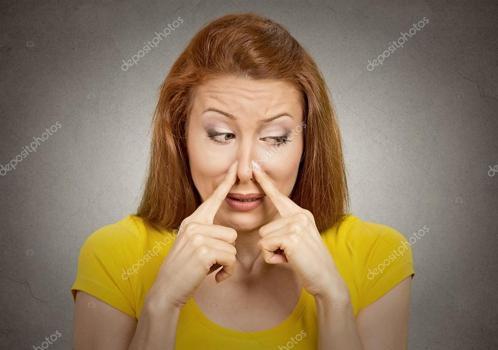 Woman pinches nose with fingers something stinks — Stock Photo ... Woman pinches nose with fingers something stinks — Stock Photo ...