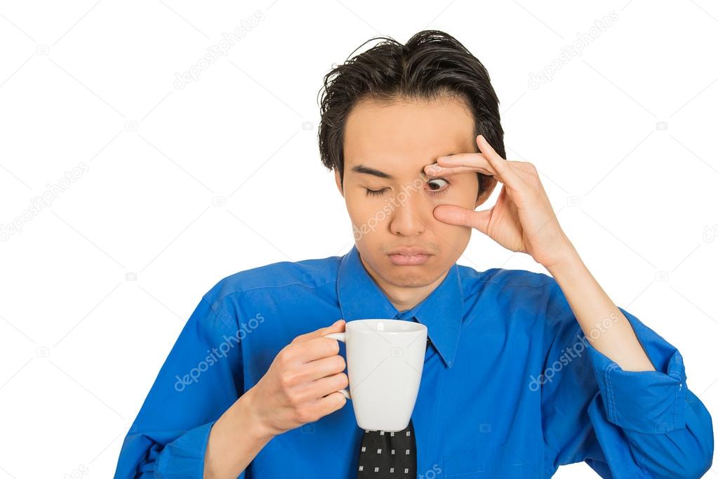 Tired falling asleep young businessman holding cup of coffee — Stock ...