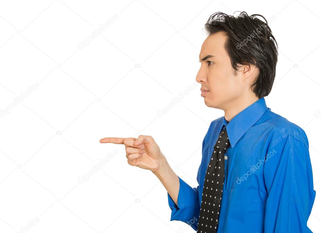 Serious man, pointing with index finger at someone Stock Photo by ...