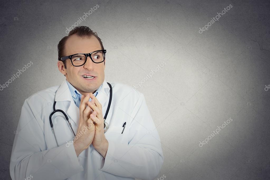 Insecure, crazy male doctor uncertain psychiatrist with glasses Stock ...