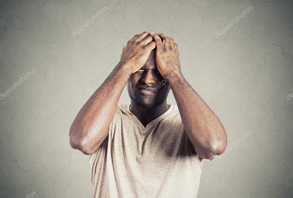 Unhappy upset guy, sad young man bothered by mistakes Stock Photo by ...
