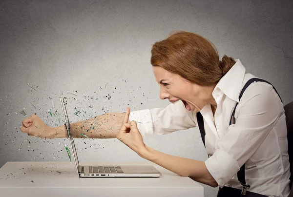 Angry business woman throws punch into computer, screaming - Stock ...