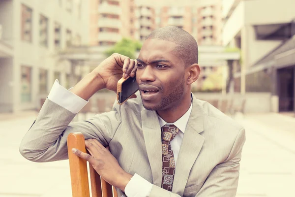unhappy upset sad, skeptical man talking on phone - Stock Image ...