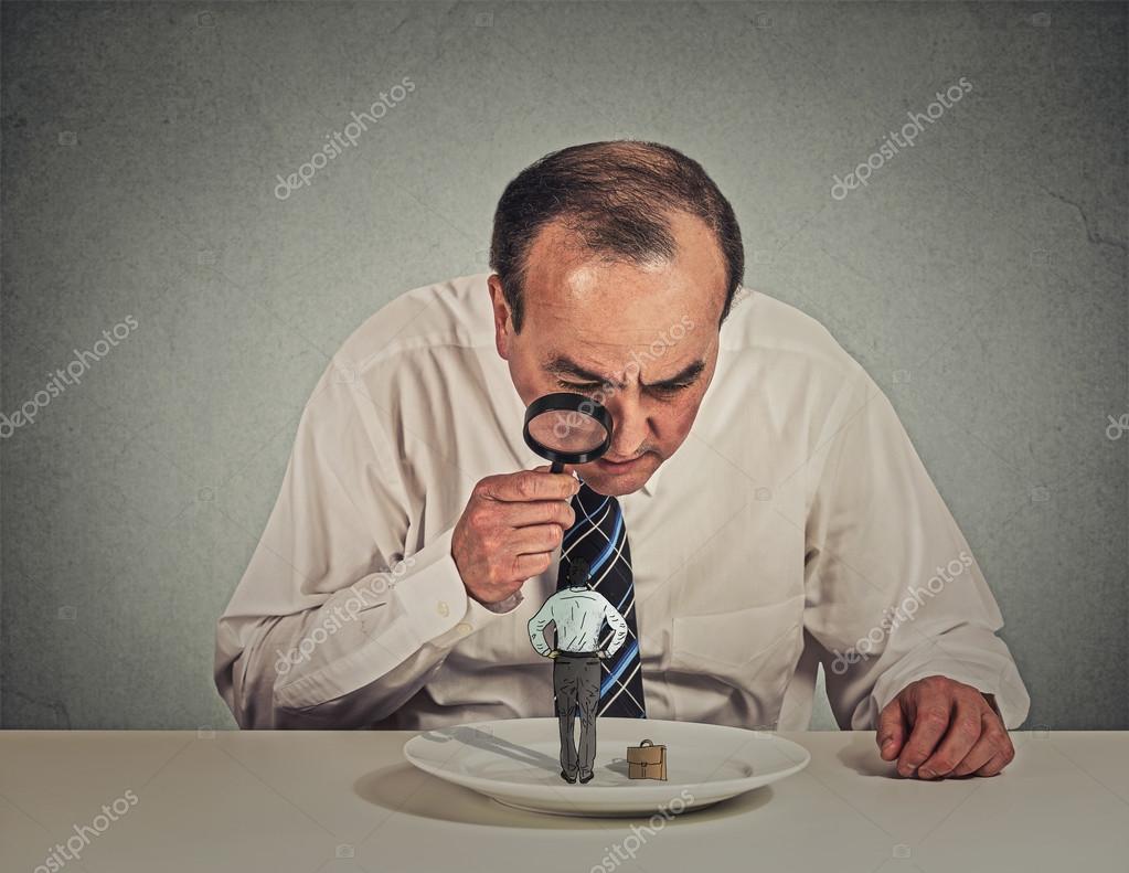 Boss skeptically looking at employee through magnifying glass — Stock ...