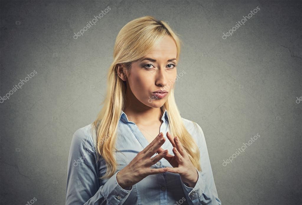 Sneaky, sly, scheming young woman plotting revenge plan Stock Photo by ...