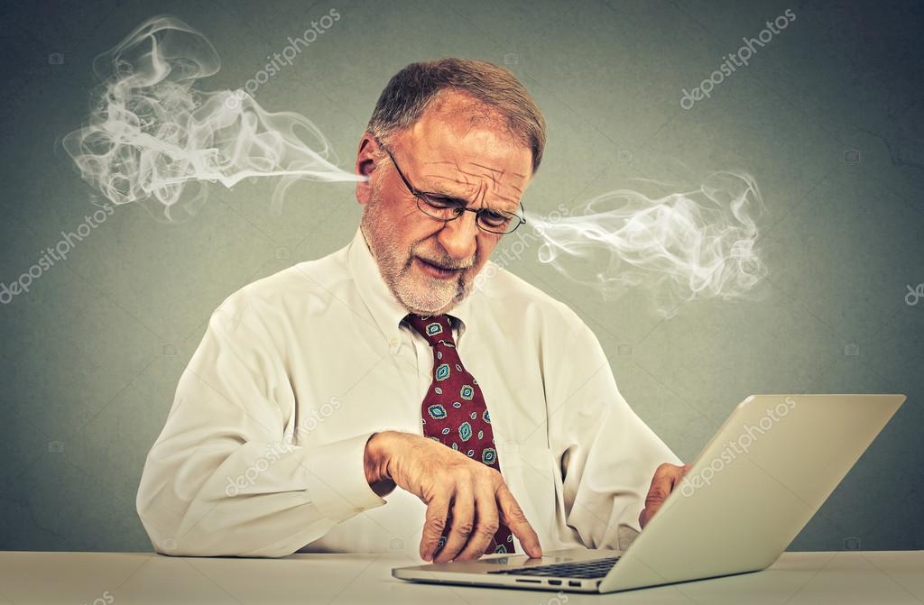 Stressed elderly old man using computer blowing steam from ears — Stock ...