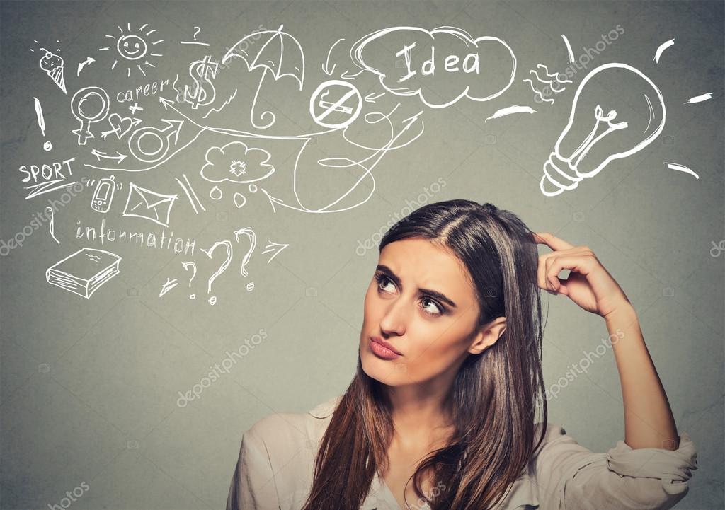 Puzzled young woman thinking scratching head has many ideas looking up ...
