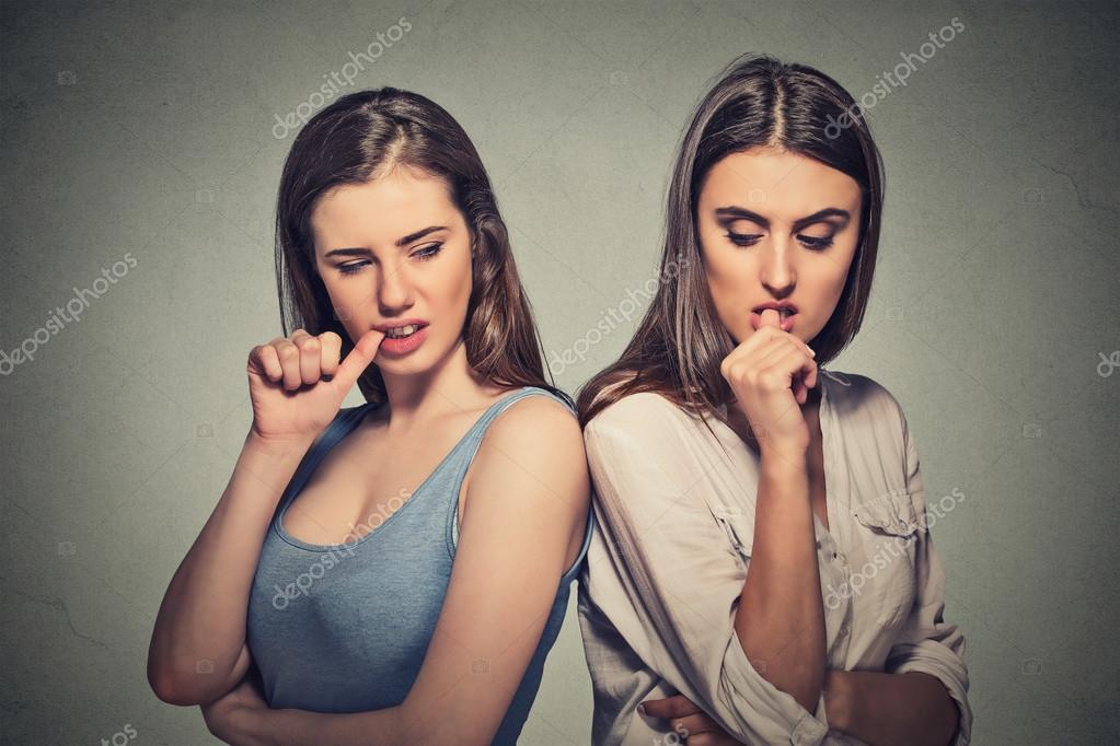Two angry girls going through a conflict in their relationship life ...