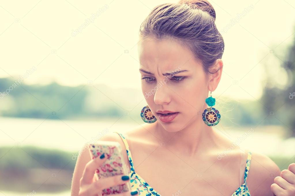 Upset sad skeptical unhappy serious woman talking texting on phone ... Upset sad skeptical unhappy serious woman talking texting on phone ...