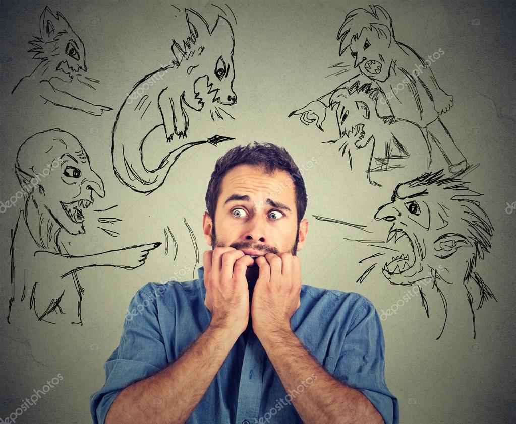 Bad evil men pointing at stressed man. Desperate scared young ...