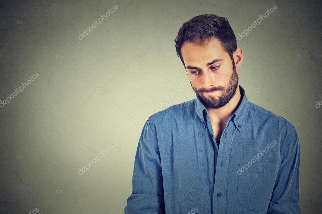 Shy young handsome man feels awkward Stock Photo by ©SIphotography 88486862
