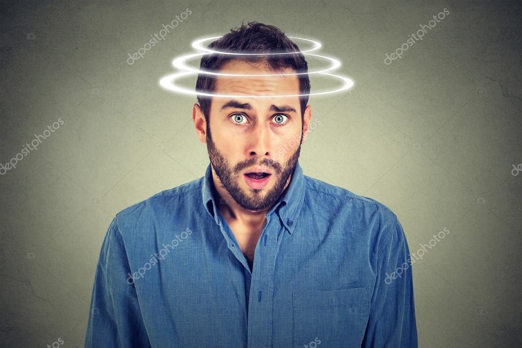 Head is spinning. Surprise astonished man. Stock Photo by ...