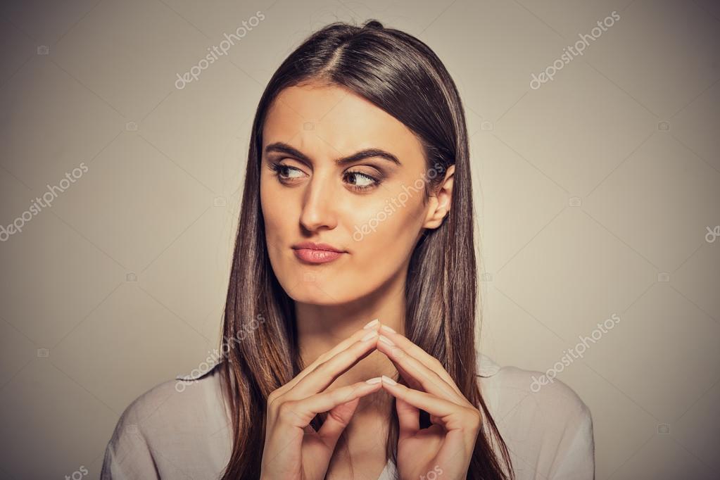Sneaky, sly, scheming young woman plotting something — Stock Photo ...