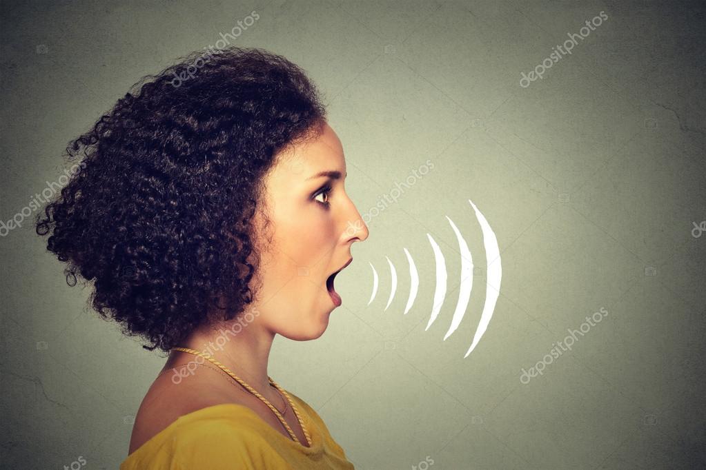 Side profile young woman talking with sound waves coming out of her ...