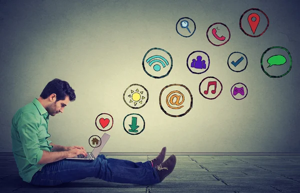 Side profile man working on laptop using social media application ...