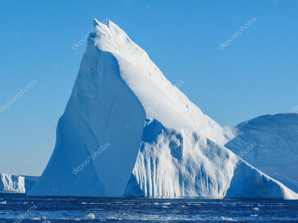 Huge iceberg in water — Stock Photo © paradoxdes #124862232
