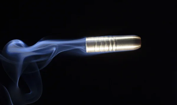 Bullet with smoke behind Stock Photo by ©gsagi 121989732