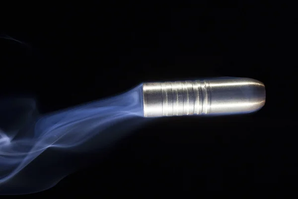 Bullet with smoke behind Stock Photo by ©gsagi 121989732