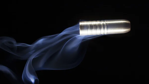 Bullet with smoke behind Stock Photo by ©gsagi 121989732
