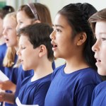Group Of School Children Singing In Choir Together Stock Photo by ...