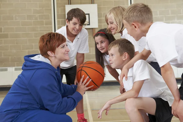 Coach Giving Team Talk To Elementary School Basketball Team - Stock ...