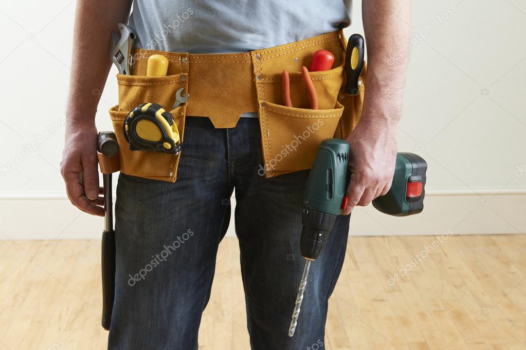 Workman Wearing Toolbelt With Tools Stock Photo by ©HighwayStarz 92613396