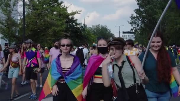 Pride parade Warsaw. Crowd of people in colorful clothing and with ...