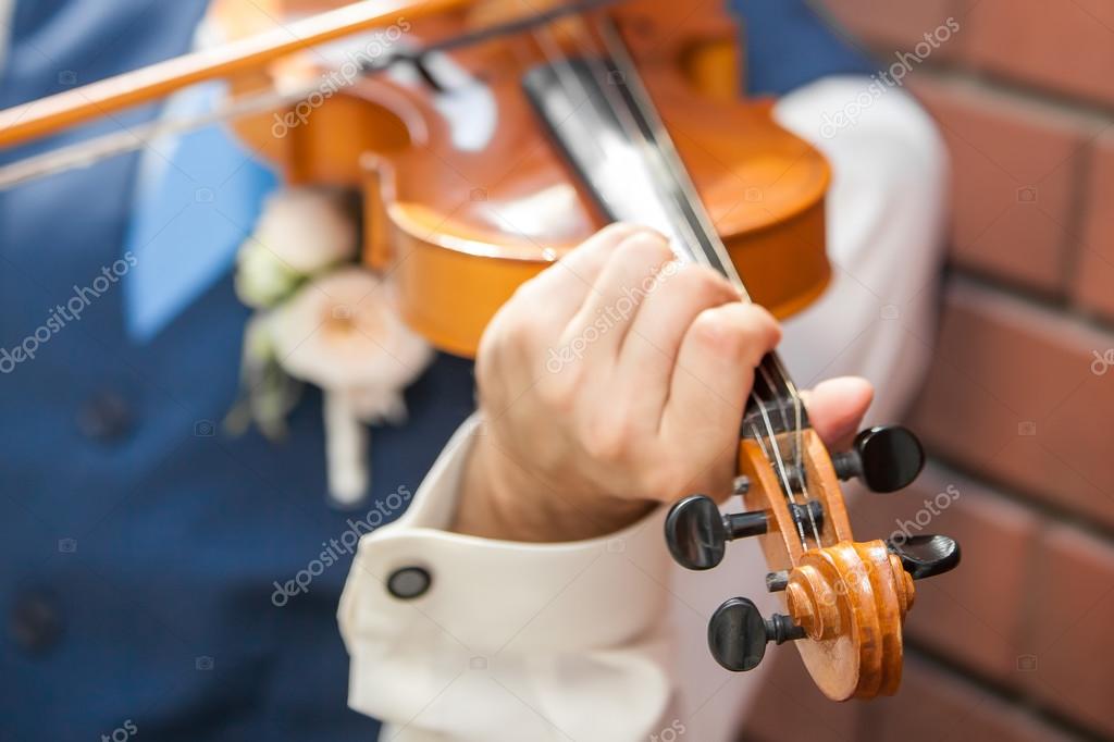 Playing the violin. — Stock Photo © erstudio #64379399