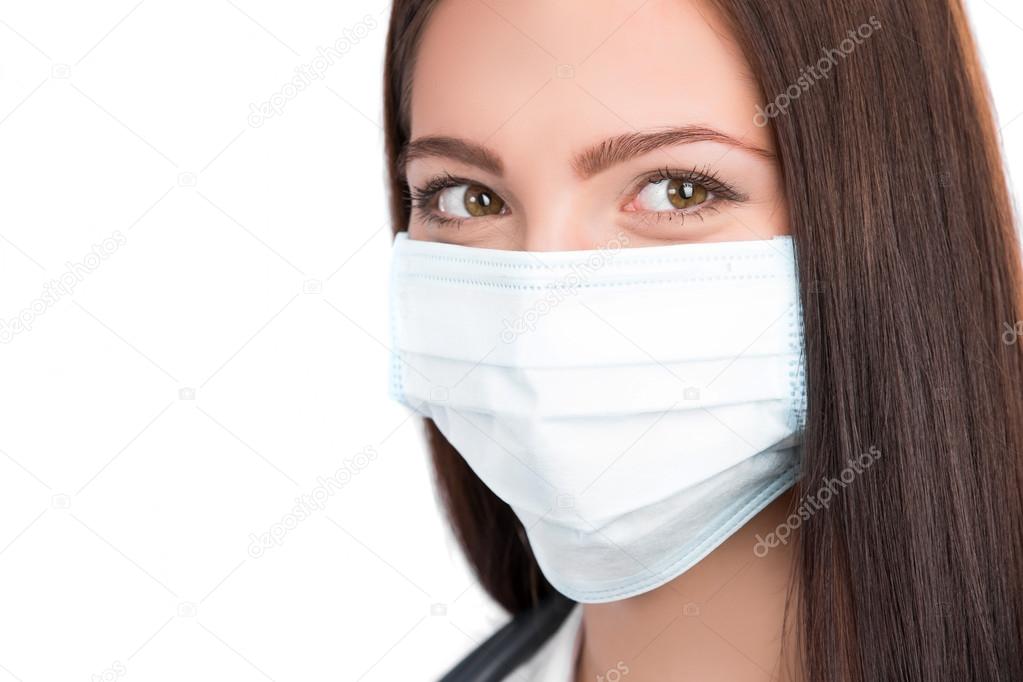 Doctor wearing surgical mask — Stock Photo © erstudio #76125097