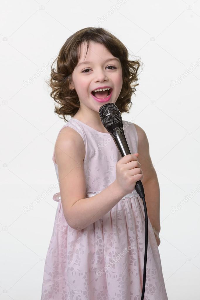 Girl Singing Into Microphone