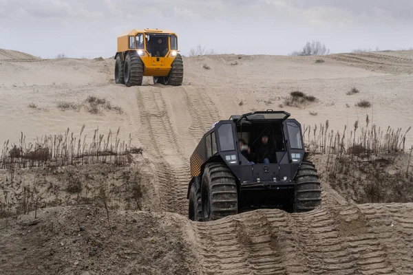 Ultimate all-terrain vehicle with huge big tires and strong yellow ...
