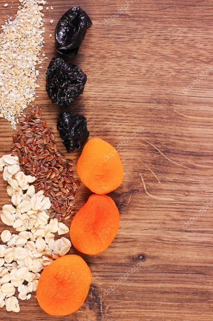 Portion of linseed, rye flakes, oat bran and dried fruits, concept of ...