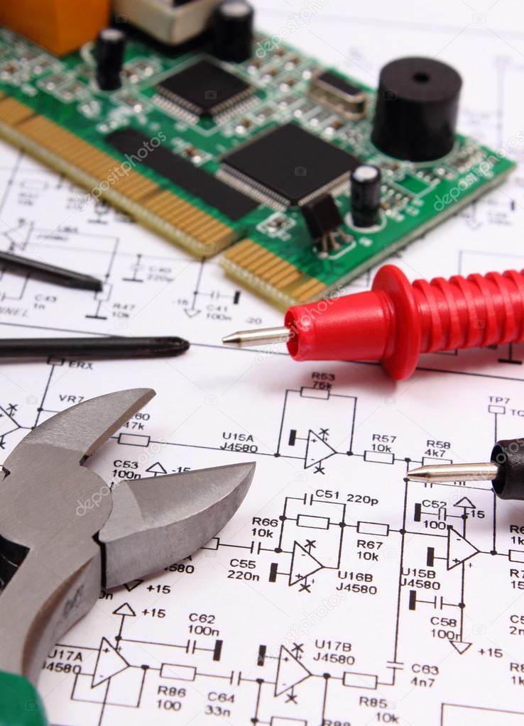 Printed circuit board. precision tools and cable of multimeter on ...