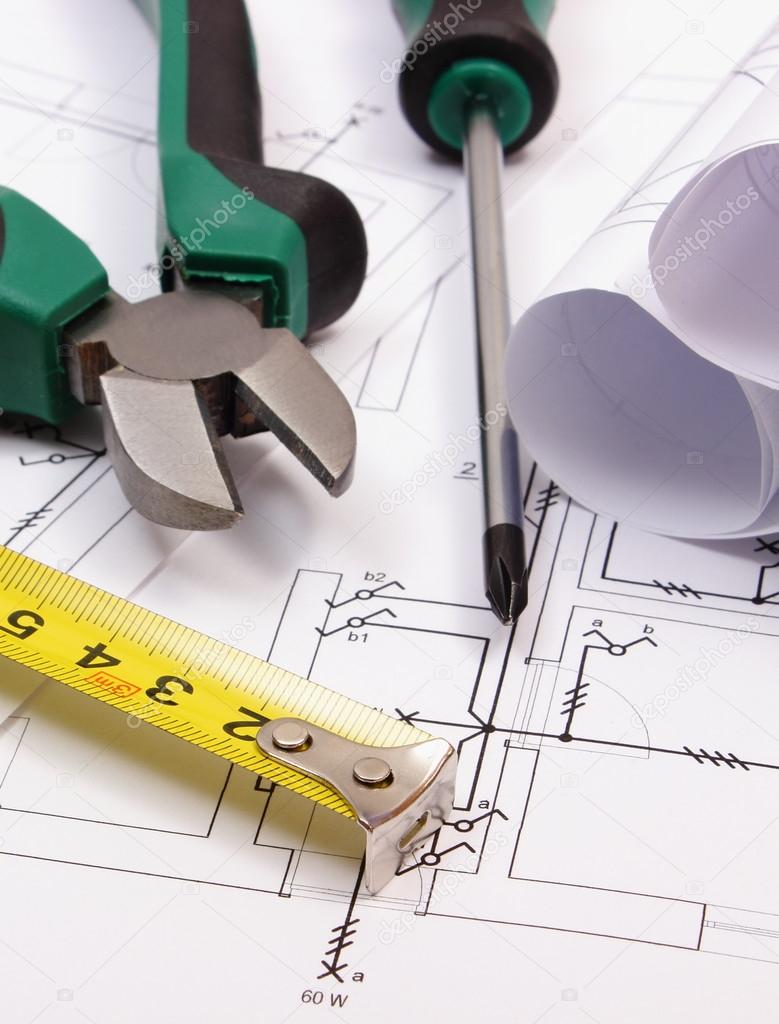Work tools and rolls of diagrams on construction drawing of house Stock ...