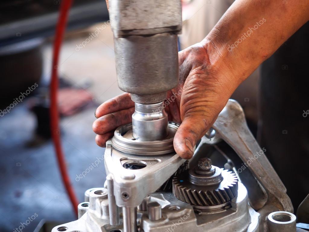 Operator repaire gear box Stock Photo by ©sorapol1150 65997233